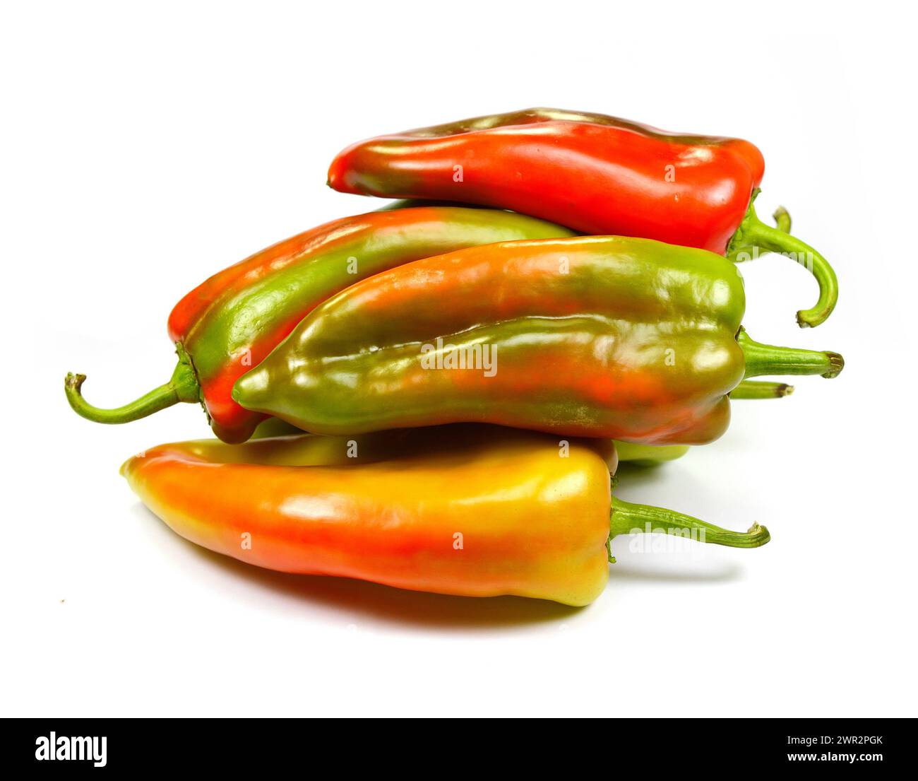 Different colored paprikas isolated on white background Stock Photo - Alamy