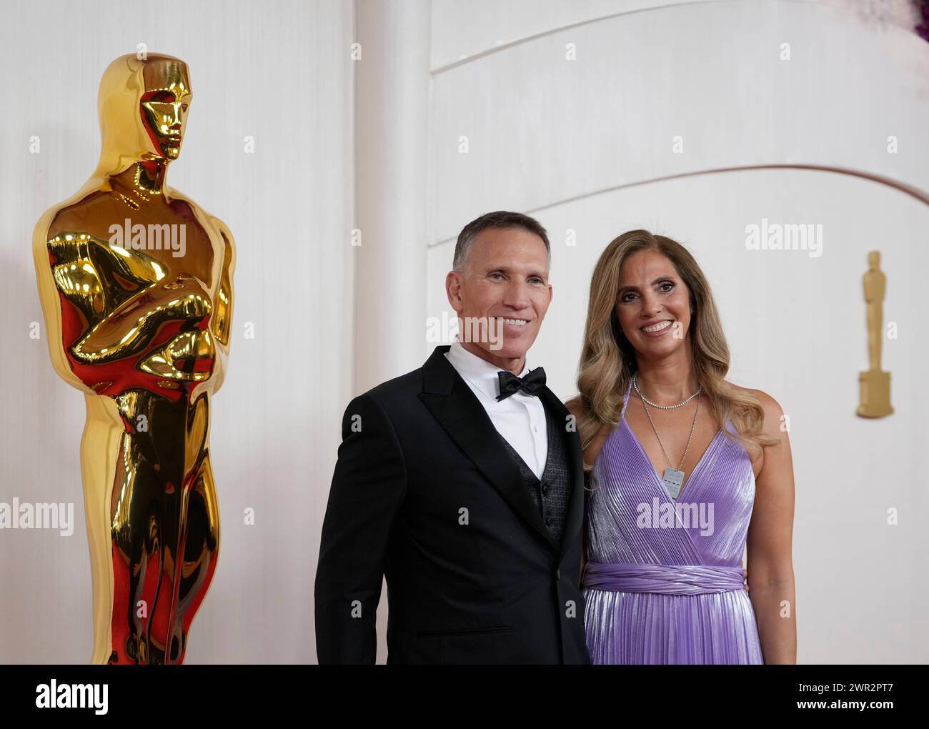 Ynon Kreiz, left and Anat Fabrikant arrive at the Oscars on Sunday ...