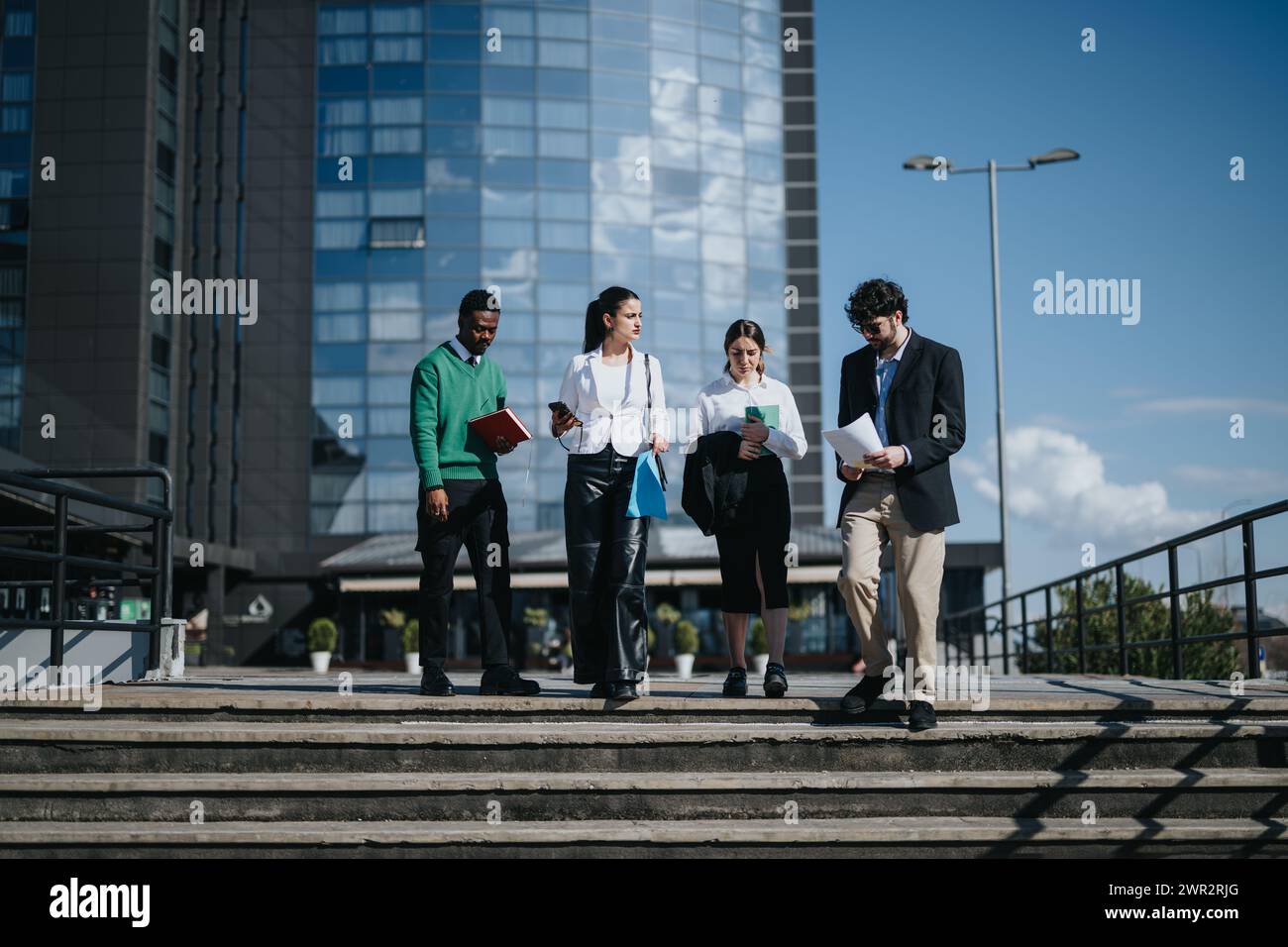 Business professionals walking together outside a modern office Stock ...