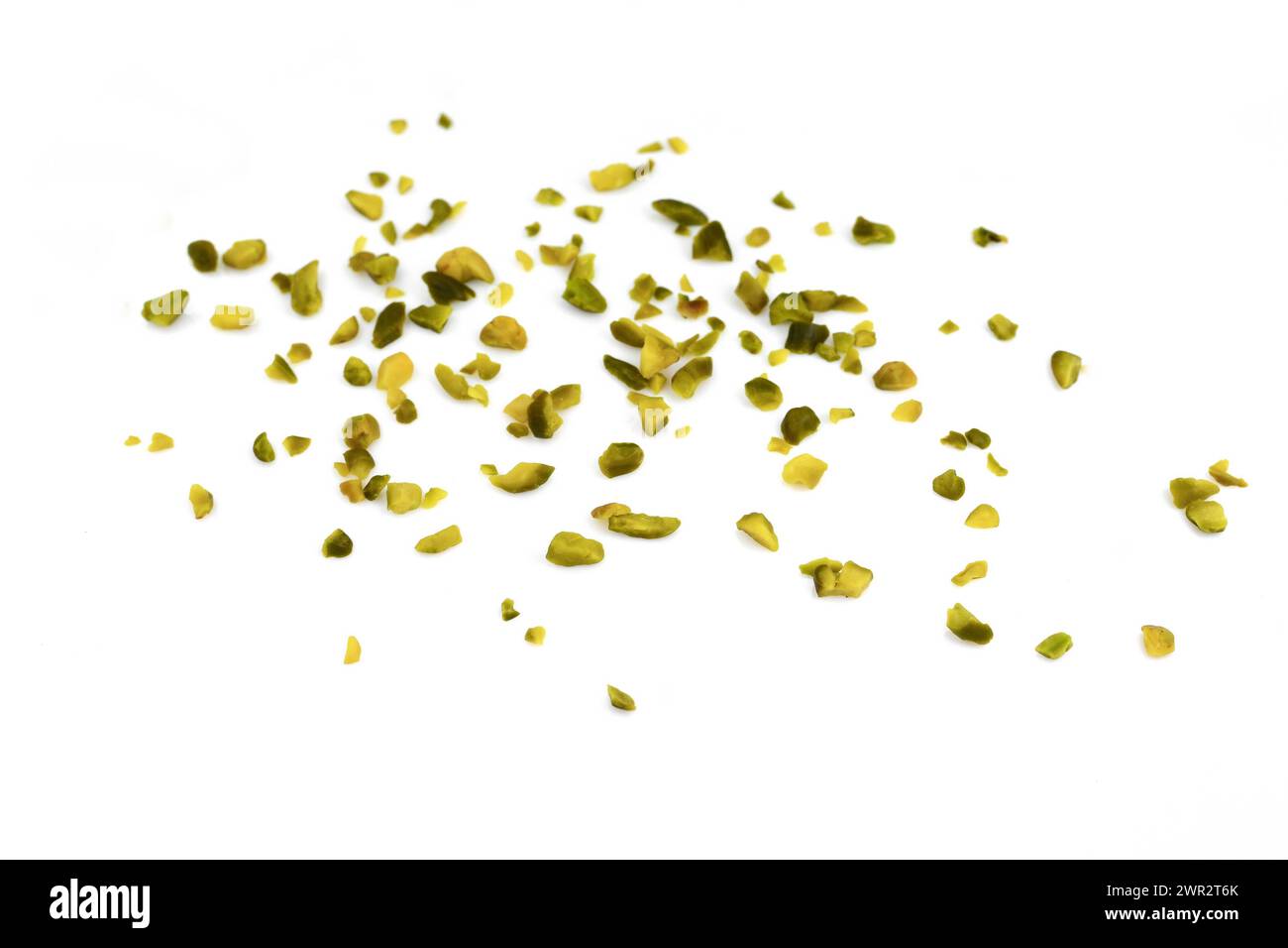 Ground, milled, crushed or granulated pistachio pile isolated on white ...