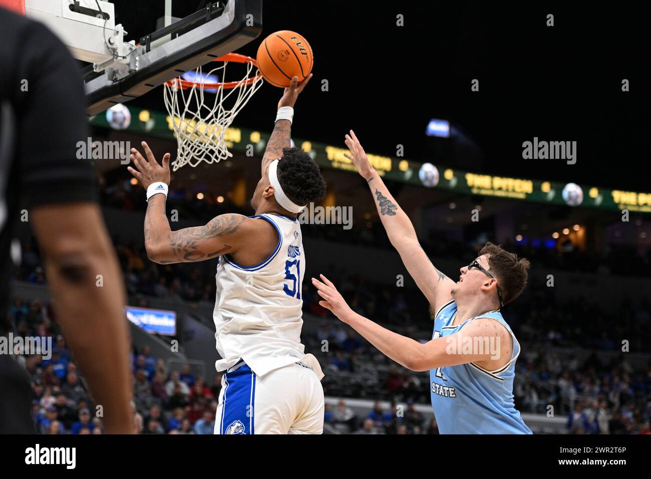 Drake's Darnell Brodie, left, goes up for a shot against Indiana State ...