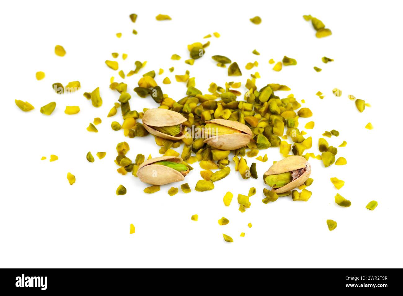 Ground, milled, crushed or granulated pistachio pile isolated on white ...