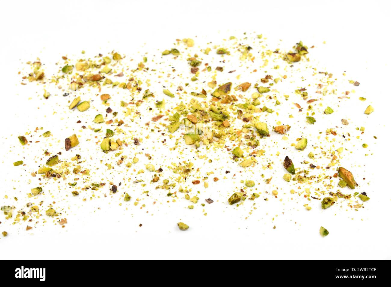 Ground, milled, crushed or granulated pistachio pile isolated on white ...
