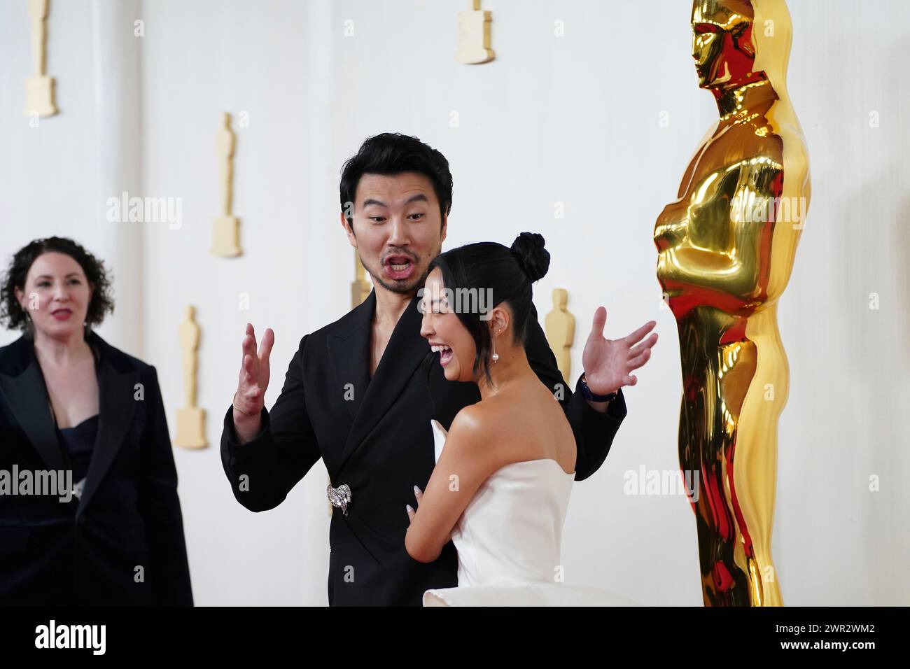 Simu Liu, left, and Allison Hsu arrive at the Oscars on Sunday, March ...