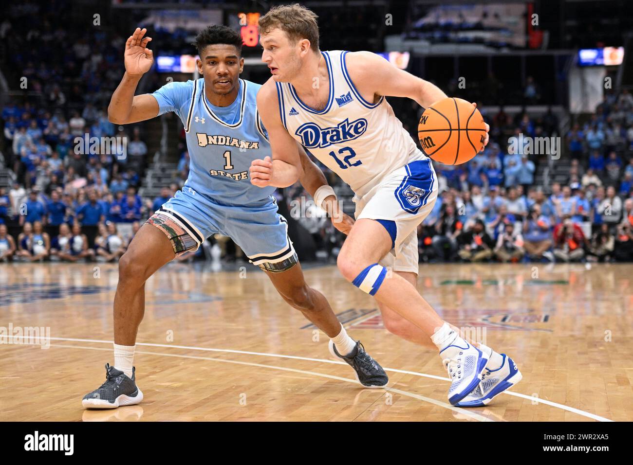 Drake's Tucker DeVries (12) drives against Indiana State's Julian Larry ...