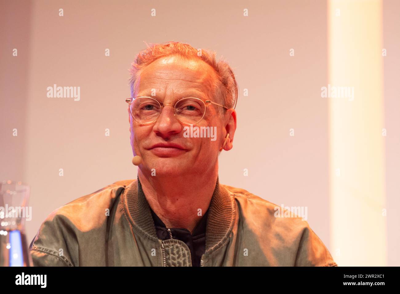 Victor Schefe, a German actor, is performing on the stage of Flora Hall ...