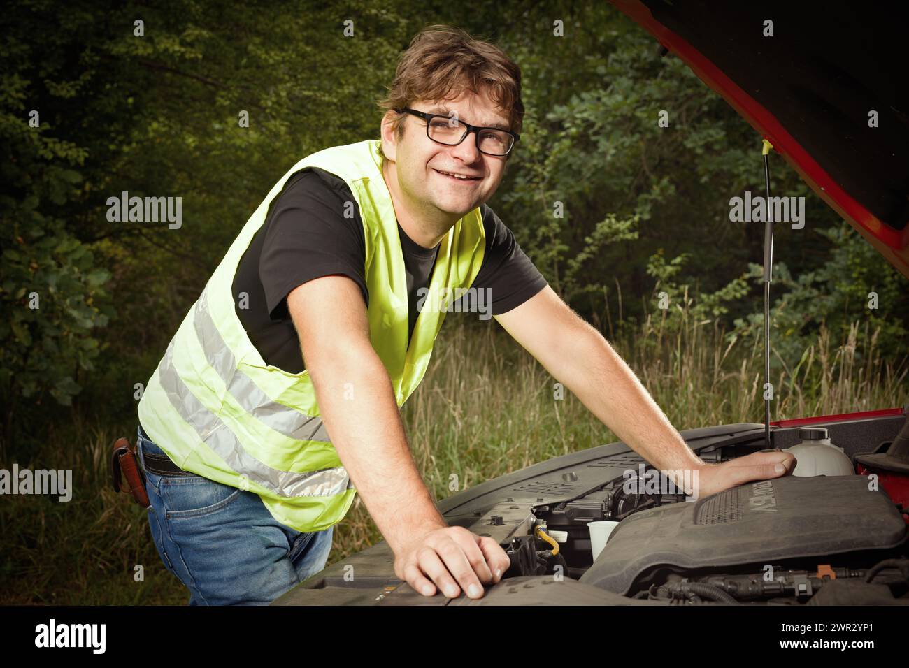 Car driver take care of his car before longer trip Stock Photo - Alamy