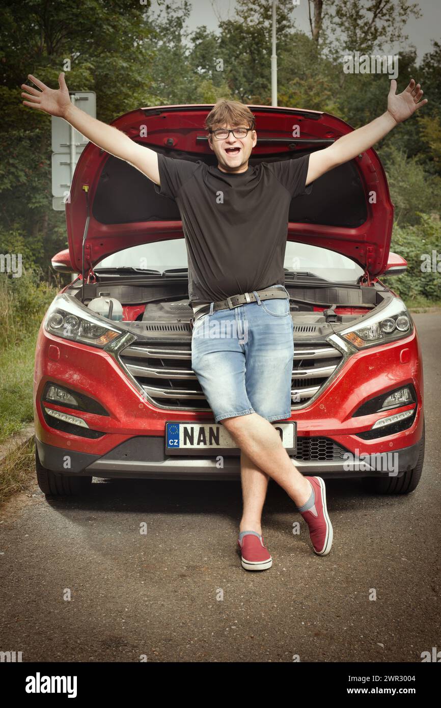 Car driver after taking care of his car before longer trip Stock Photo ...