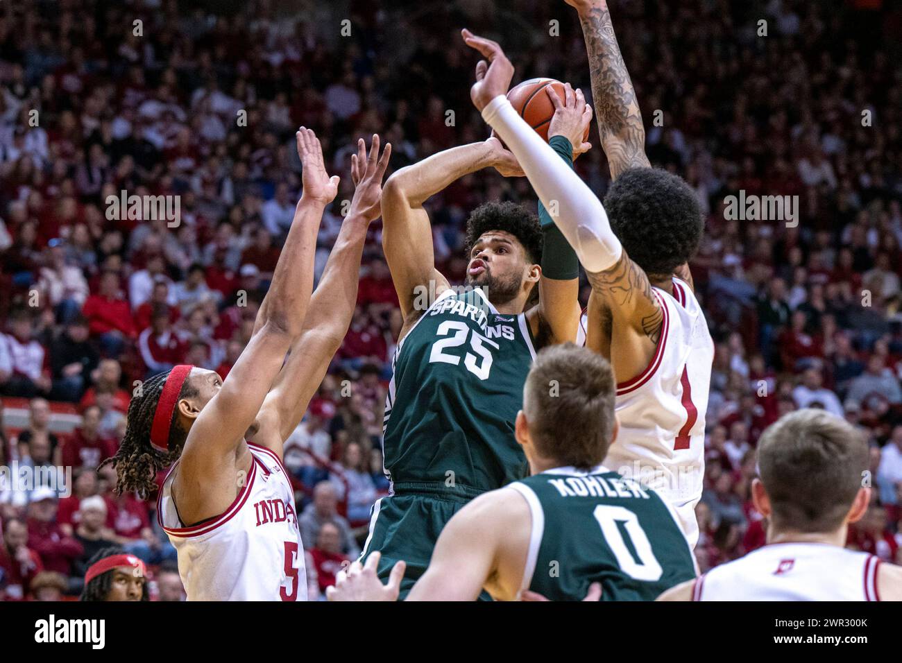 Michigan State forward Malik Hall (25) shoots while defended by Indiana ...