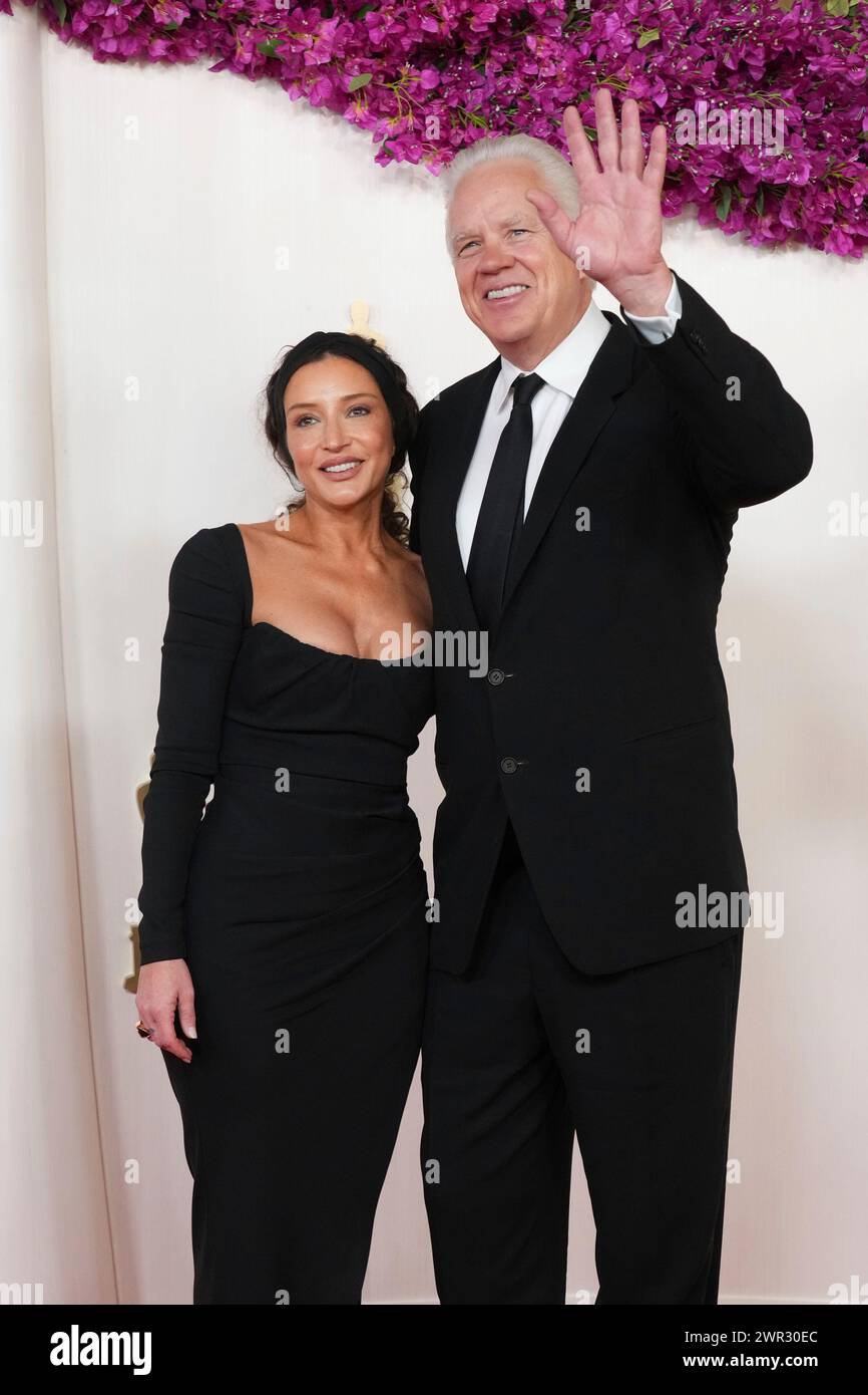 Reed Morano, left, and Tim Robbins arrive at the Oscars on Sunday ...