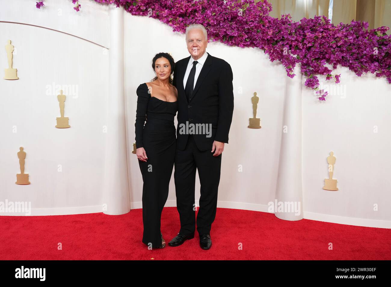 Reed Morano, left, and Tim Robbins arrive at the Oscars on Sunday ...