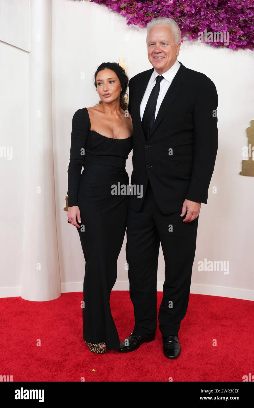 Reed Morano, left, and Tim Robbins arrive at the Oscars on Sunday ...