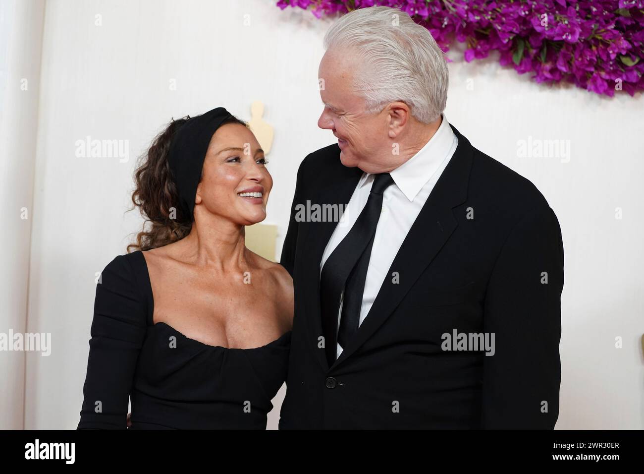Reed Morano, left, and Tim Robbins arrive at the Oscars on Sunday ...