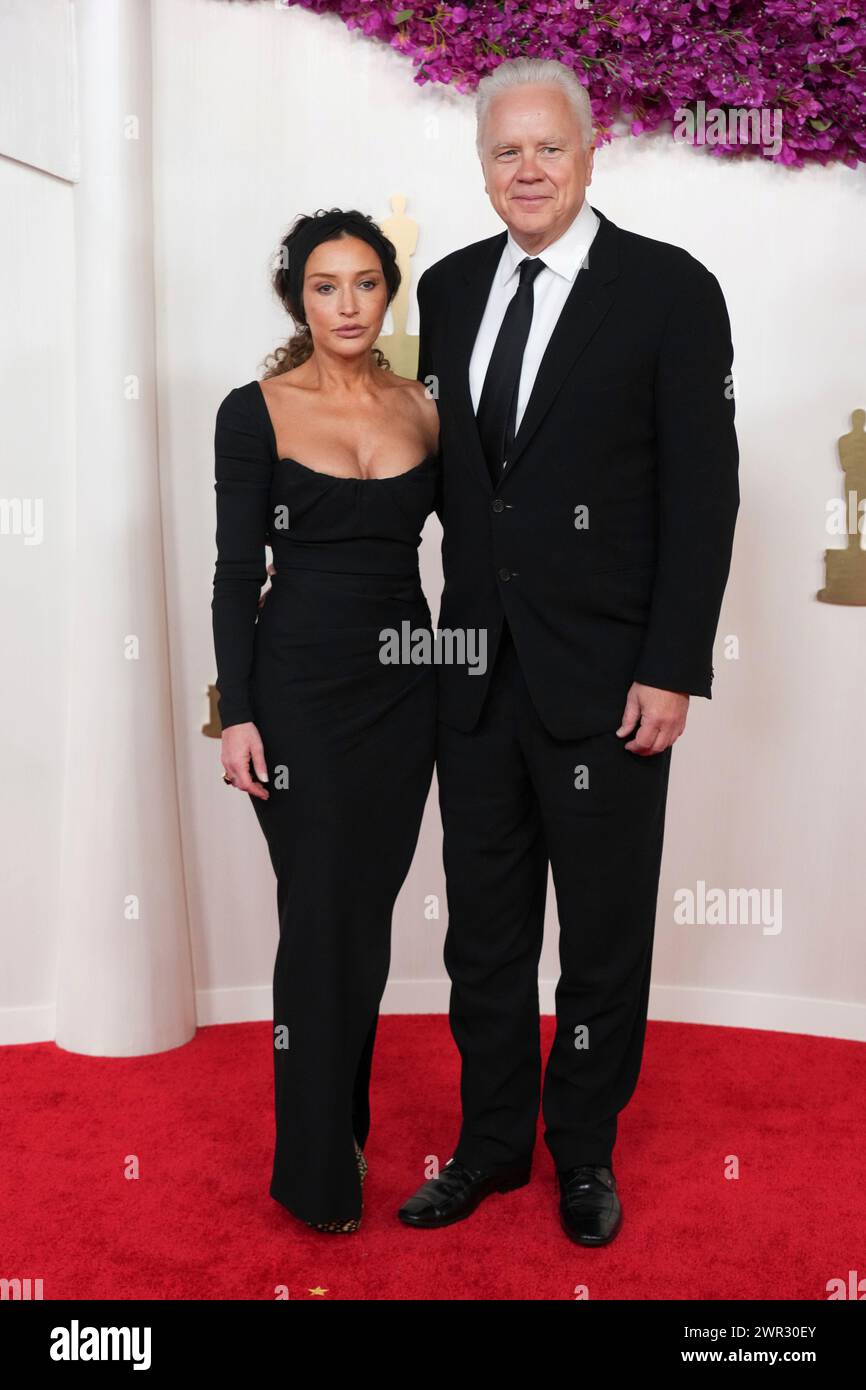 Reed Morano, left, and Tim Robbins arrive at the Oscars on Sunday ...