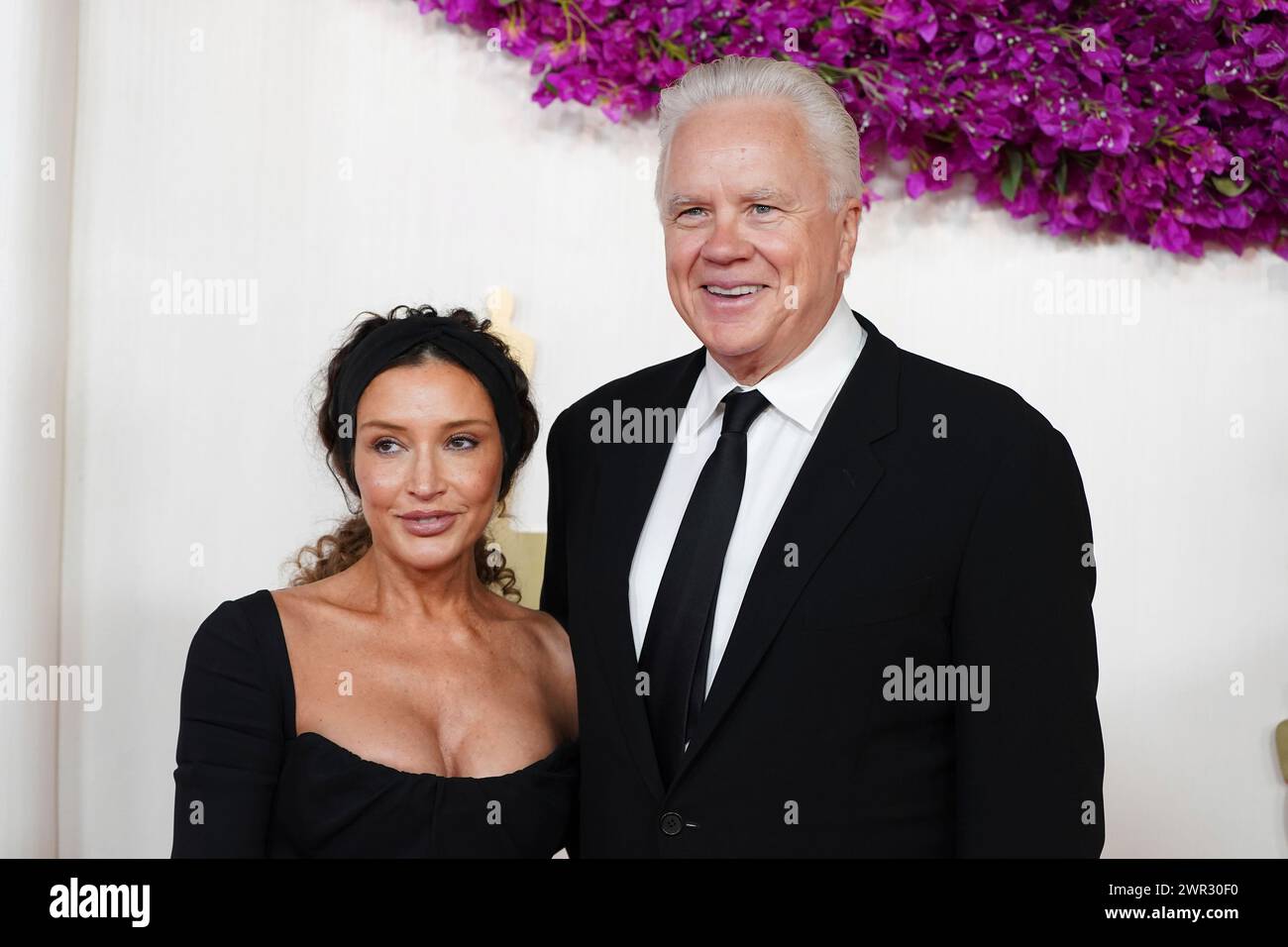 Reed Morano, left, and Tim Robbins arrive at the Oscars on Sunday ...