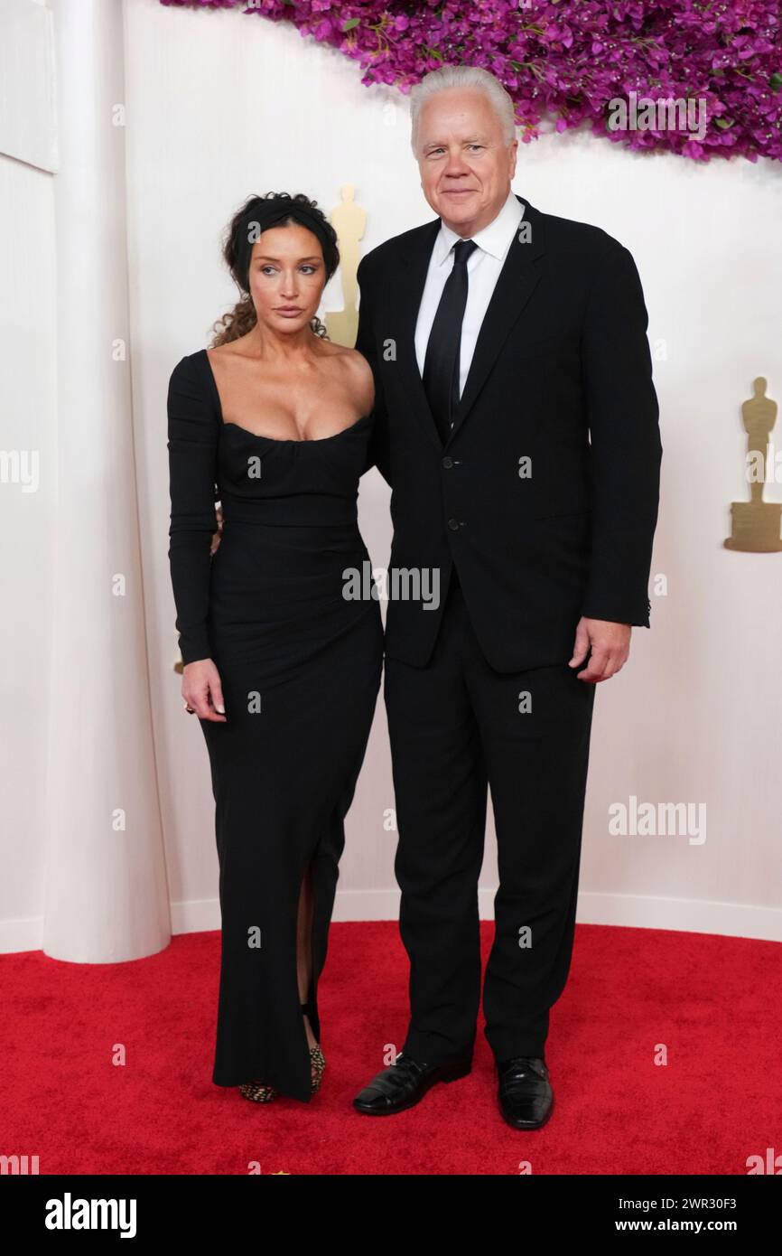 Reed Morano, left, and Tim Robbins arrive at the Oscars on Sunday ...