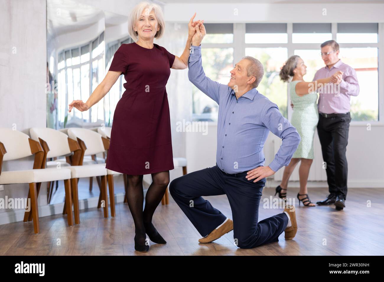 Senior man and elderly woman are dancing contemporary discofox in ...