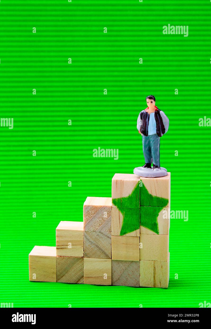 Man on top achieving goal after passing different levels Stock Photo ...