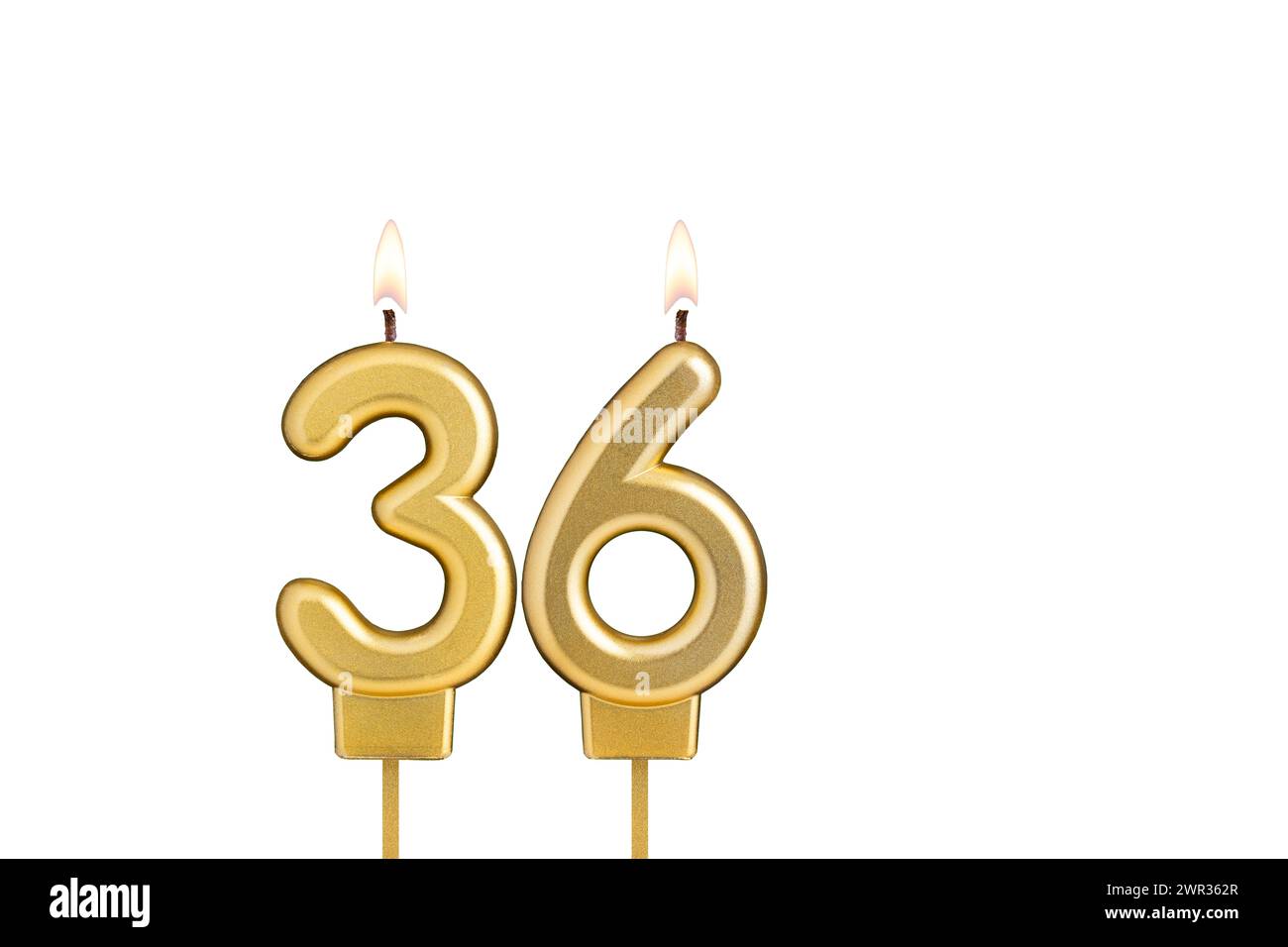 Golden number 36 birthday candle on white background Stock Photo - Alamy