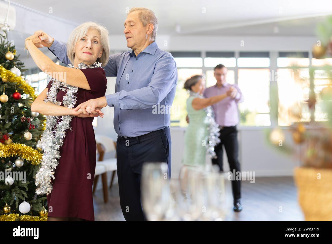 Elderly man and elderly woman dance waltz Stock Photo - Alamy