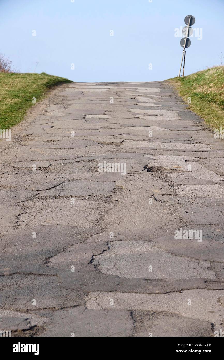 Broken road, need for renovation, Germany Stock Photo - Alamy