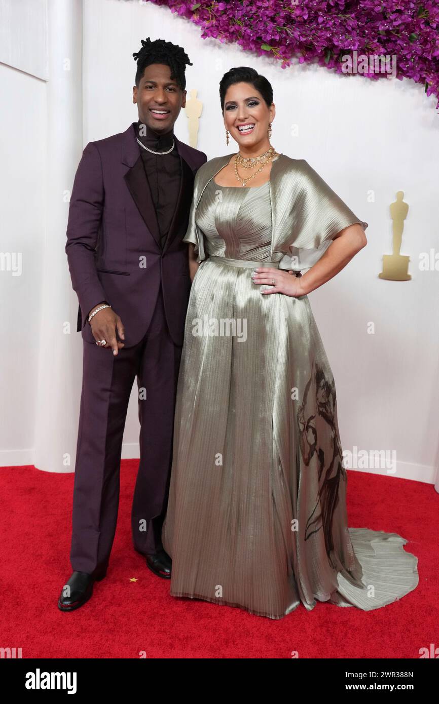 Jon Batiste, left, and Suleika Jaouad arrive at the Oscars on Sunday ...