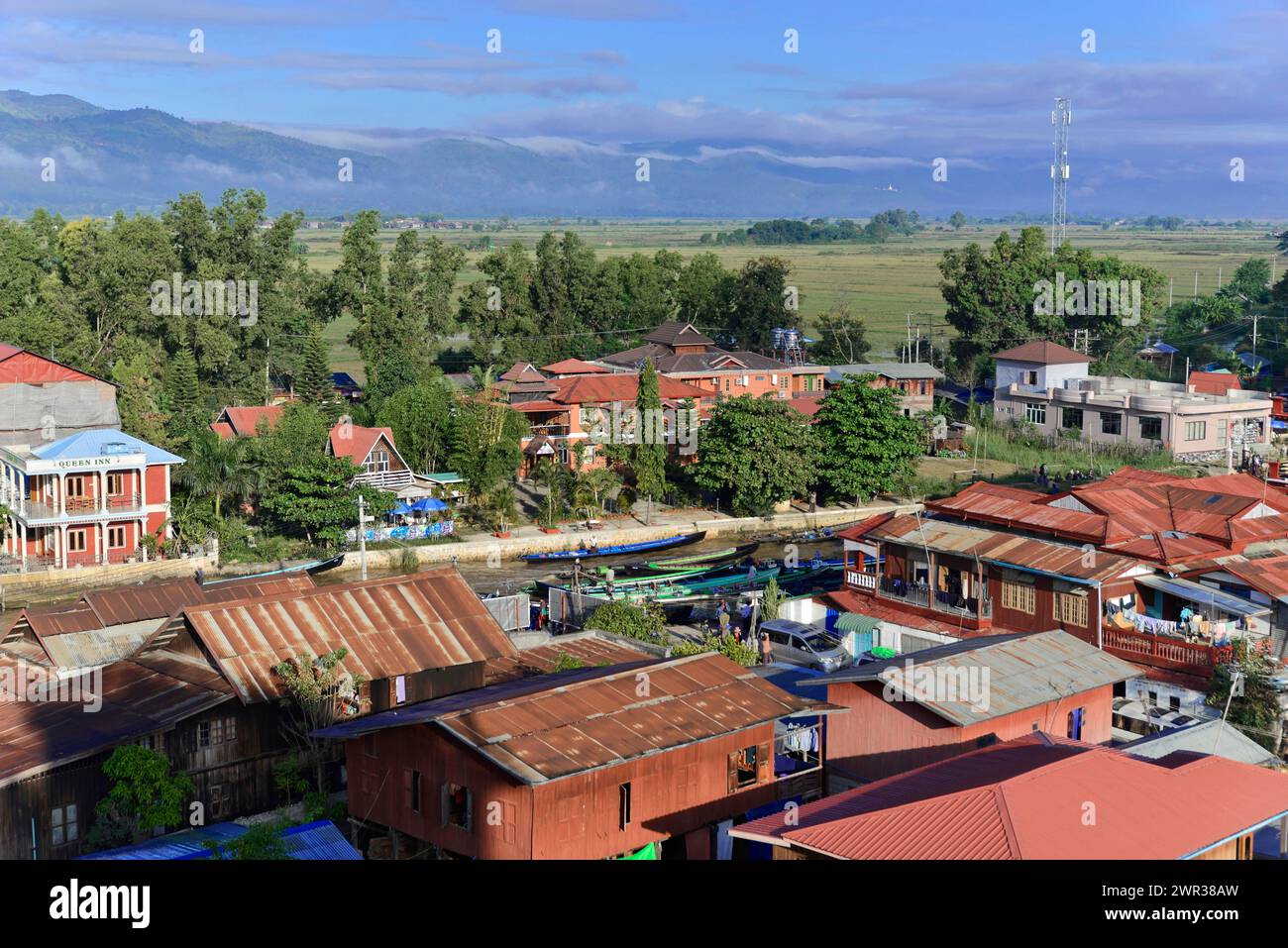 Aerial view of a town with traditional houses surrounded by nature ...