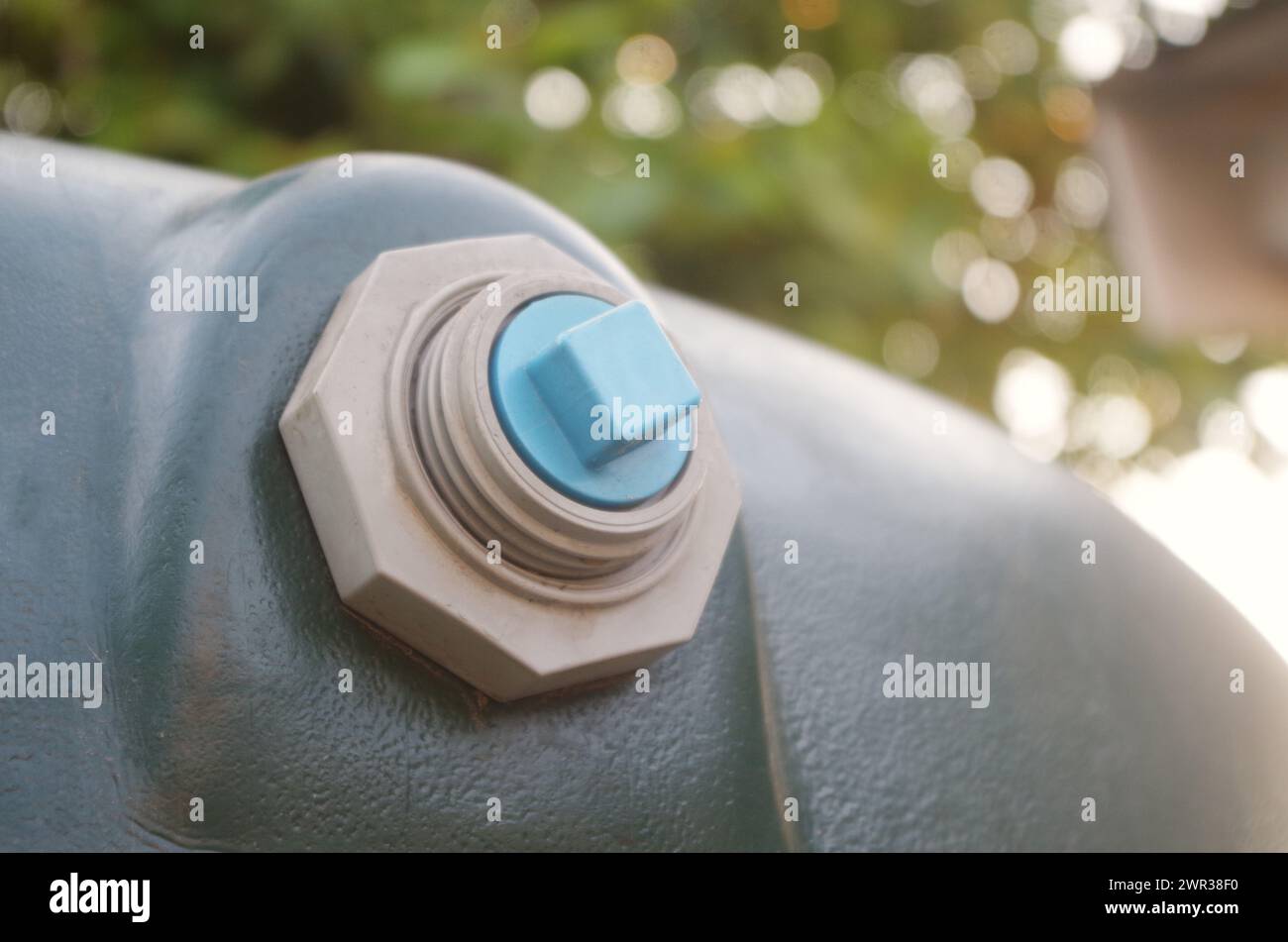 Blue plastic plug for closing the water system on large water tanks ...
