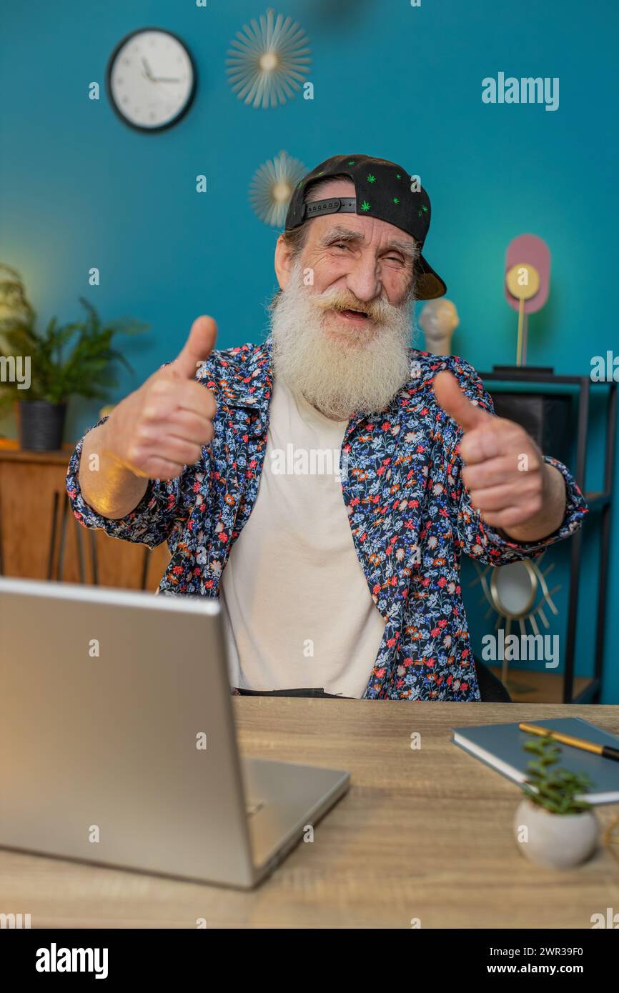 Like. Smiling stylish senior old man looking approvingly at camera ...