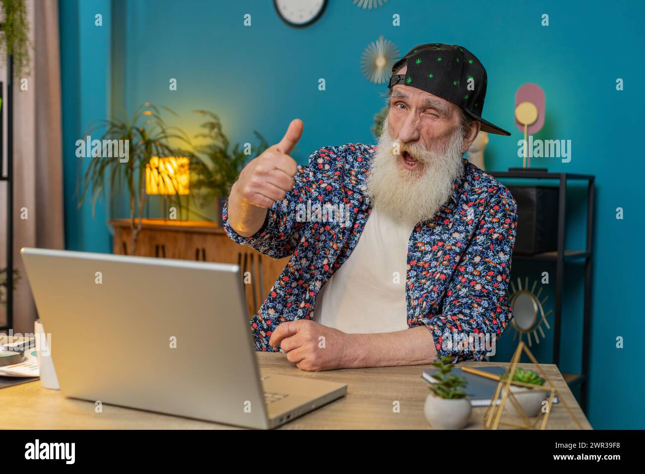 Like. Smiling stylish senior old man looking approvingly at camera ...