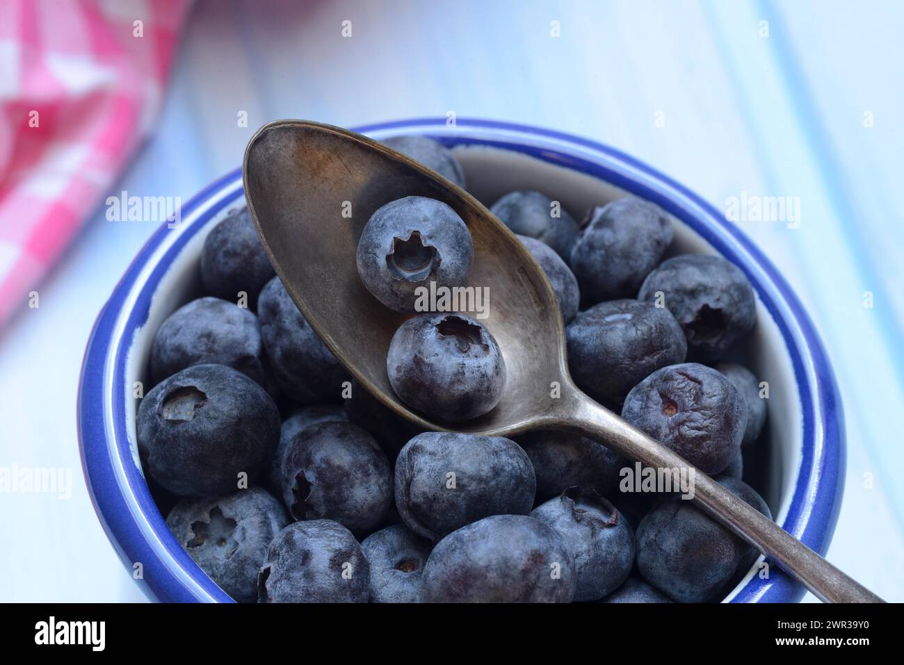 Blueberries in cup, cultivated blueberry Stock Photo - Alamy