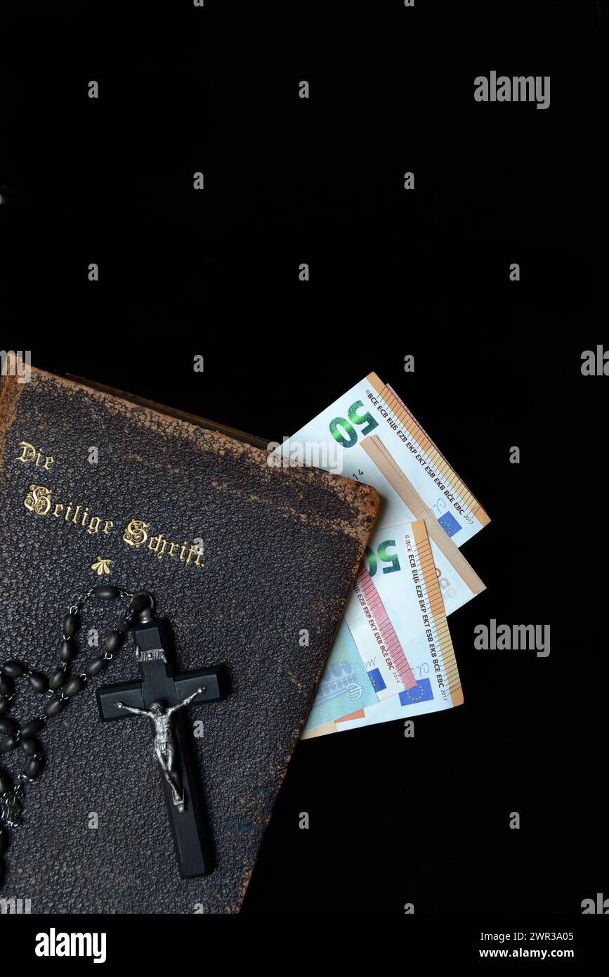 Bible, crucifix and banknotes, church and money, church tax Stock Photo ...