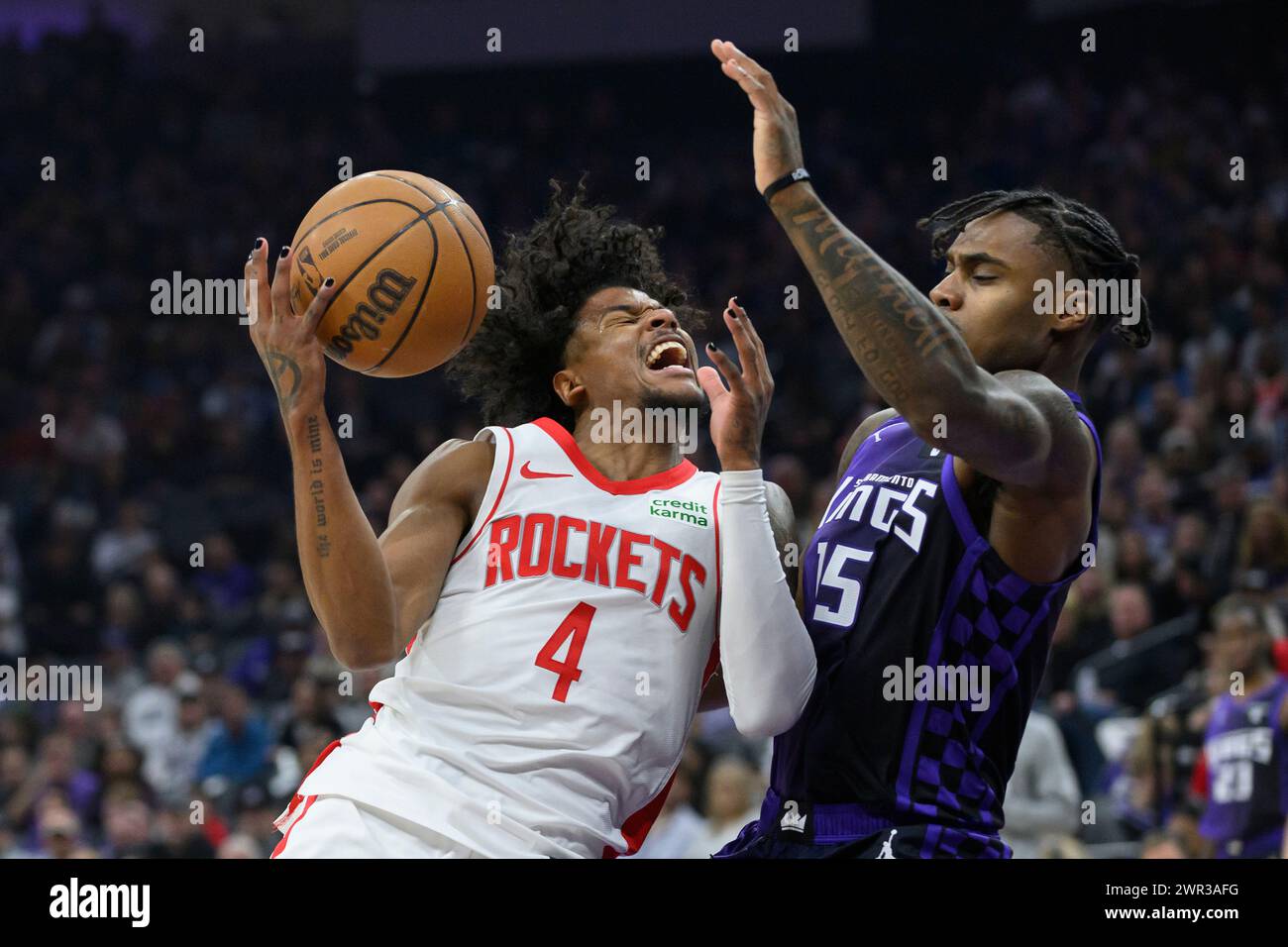 Houston Rockets guard Jalen Green (4) is fouled by Sacramento Kings ...
