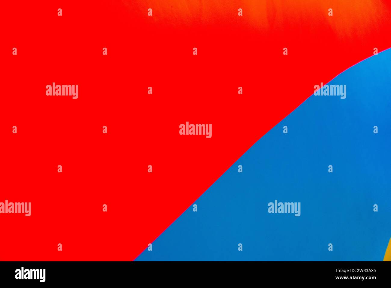 frame with two strong colors, red and blue framed in an asymmetrical ...