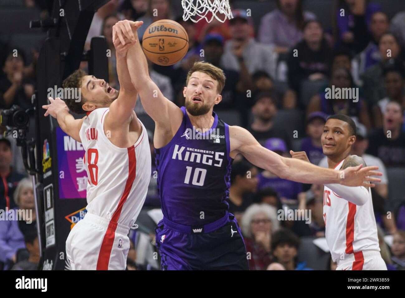 Houston Rockets center Alperen Sengun, left, and Sacramento Kings ...