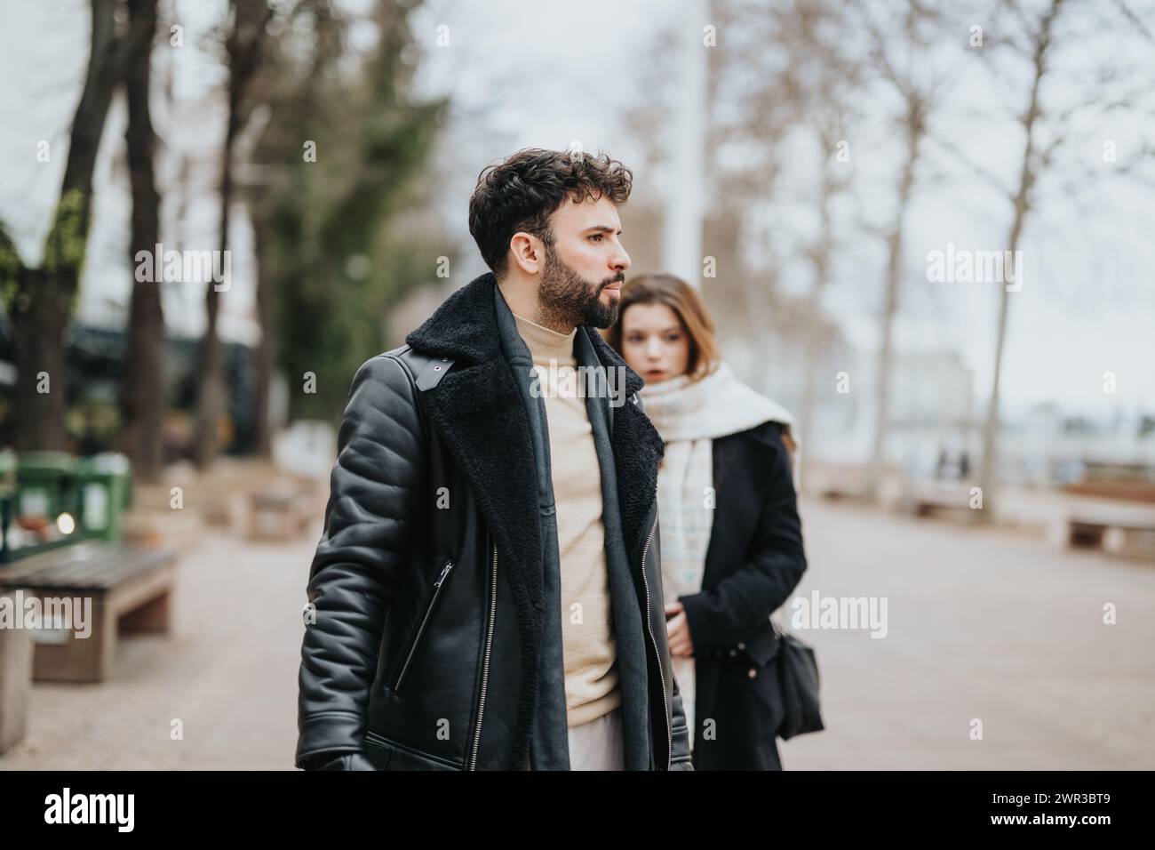 Two multiethnic business colleagues engaged in a serious discussion ...