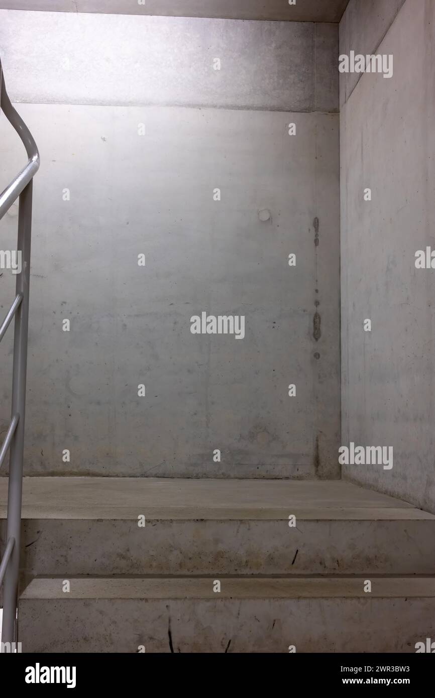 View of an empty stairwell with white concrete walls and steps Stock ...