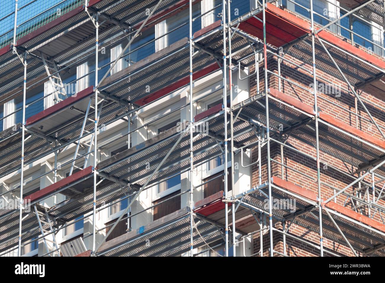 Detailed view of a building under construction with complex scaffolding ...