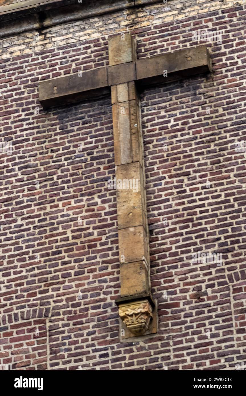 Large stone cross on a brick wall of a church Stock Photo - Alamy