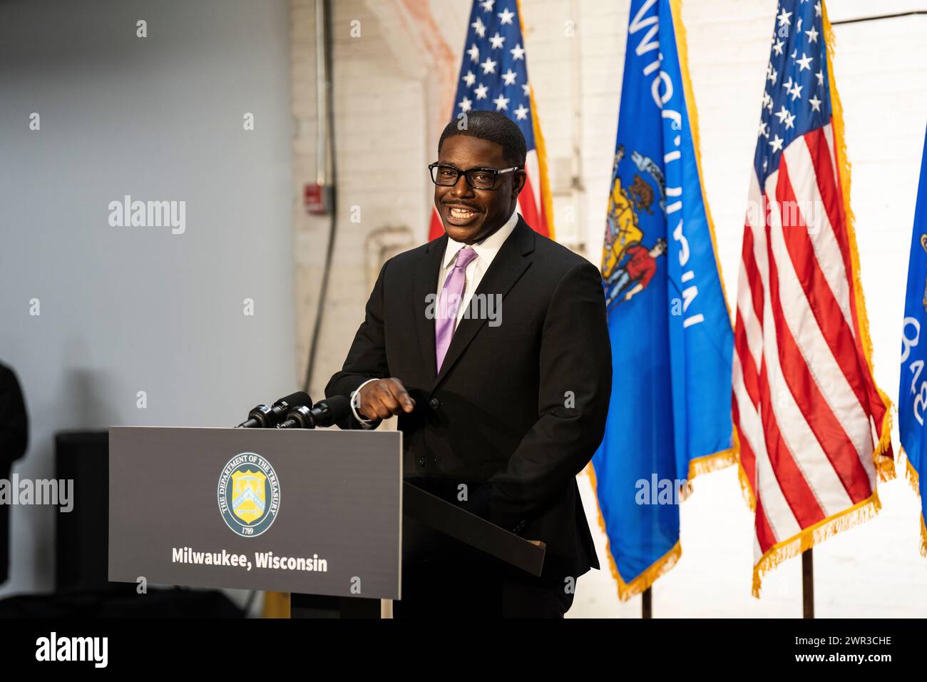 Milwaukee County Executive David Crowley gives a speech at a podium in ...