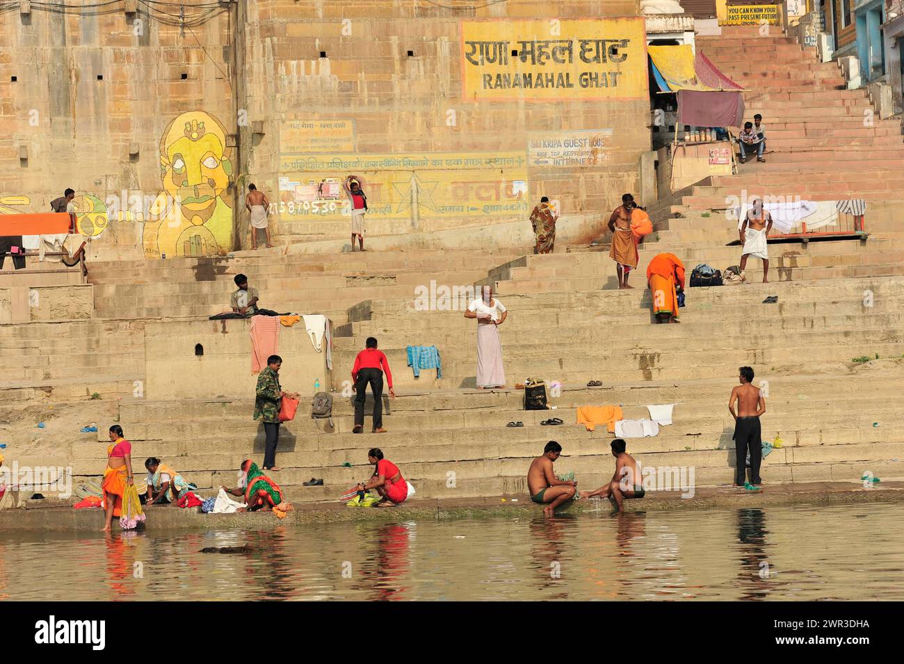 People performing ritual ablutions and prayers at the traditional ghats ...