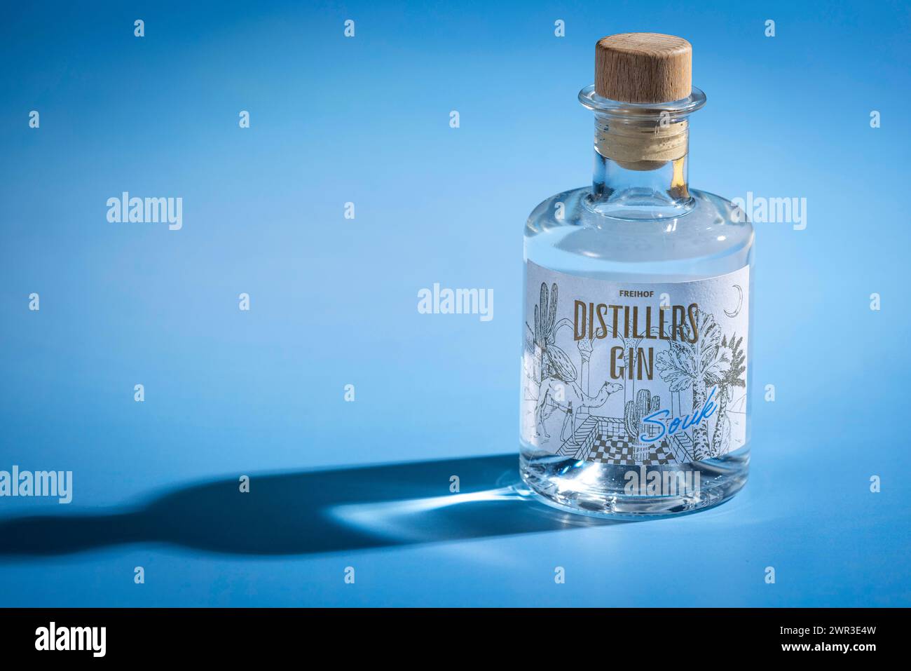Bottle of gin on a blue background with interesting shadows Stock Photo ...