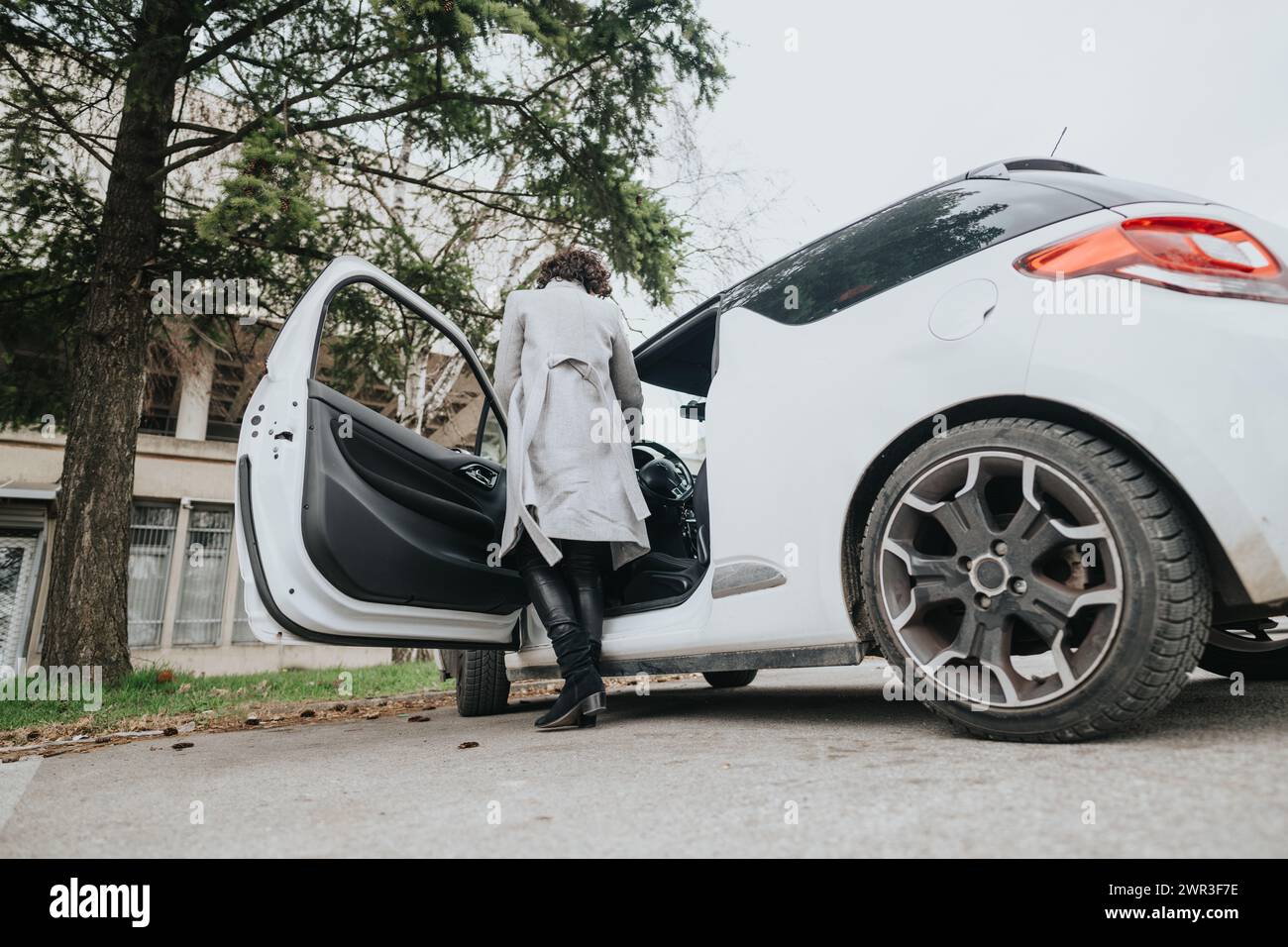 Driver stepping out of car hi-res stock photography and images - Alamy