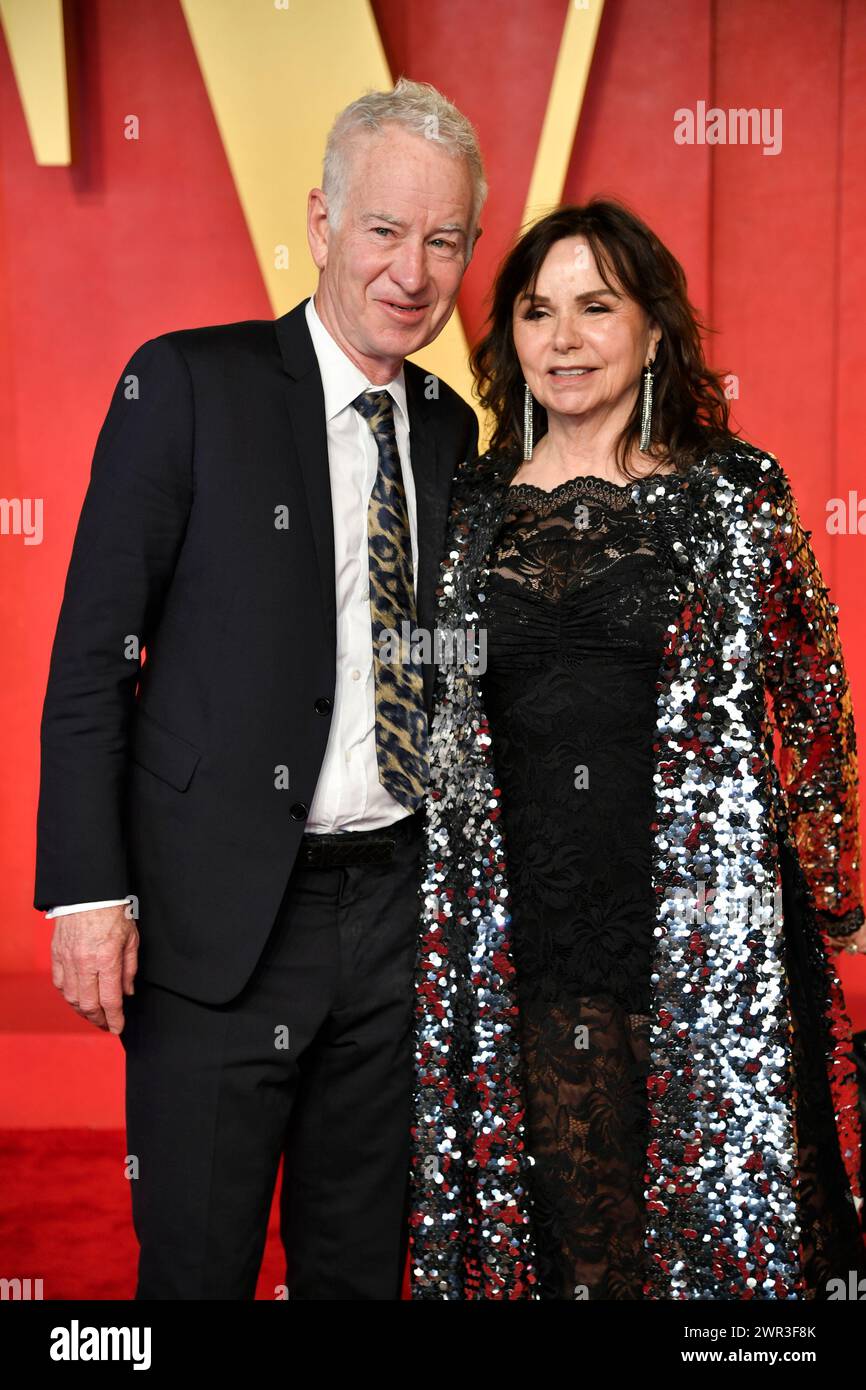 John McEnroe, left, and Patty Smyth arrive at the Vanity Fair Oscar ...