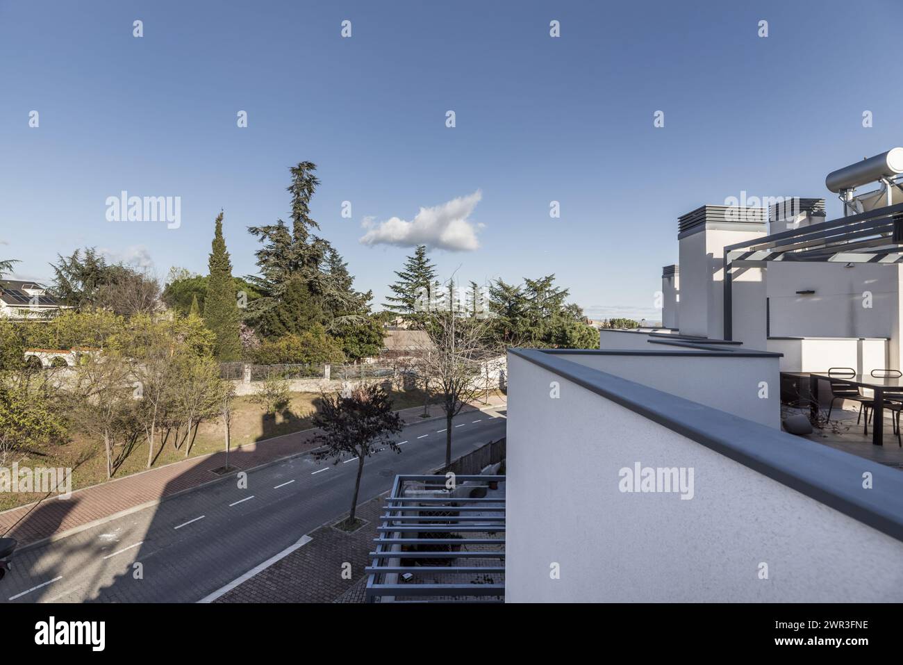 Views from the terrace of a house on the curve of a one-way street in ...