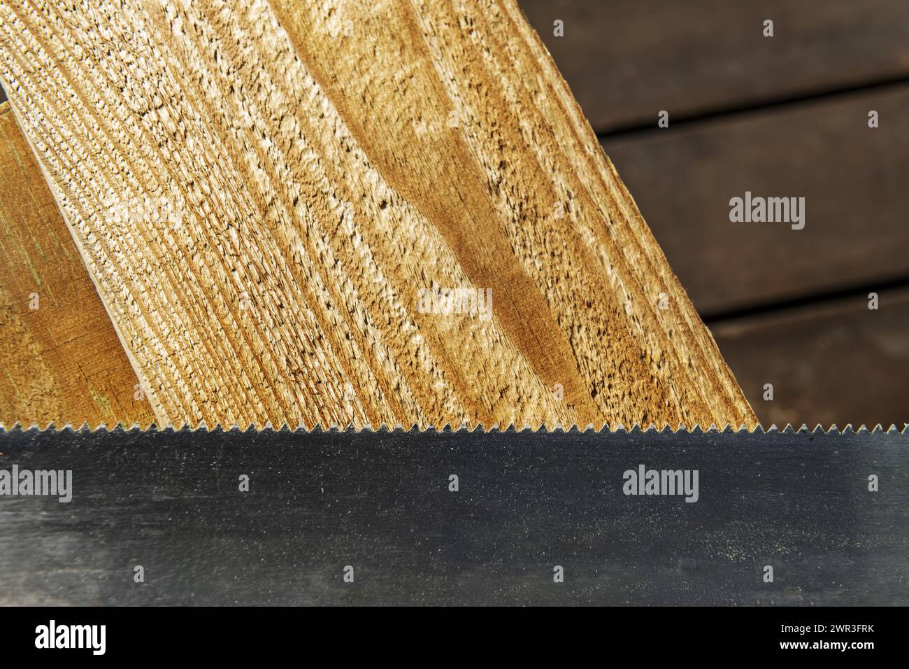 Carpenter's metalic saw teeth on some wooden boards Stock Photo - Alamy