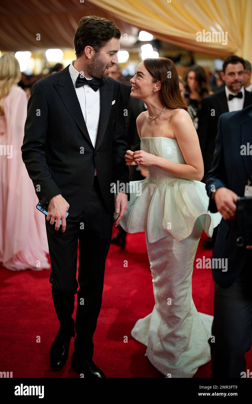 Dave McCary, left, and Emma Stone arrive at the Oscars on Sunday, March ...