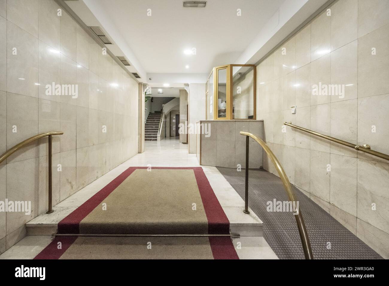 Access portal to a residential apartment building with marble-covered ...