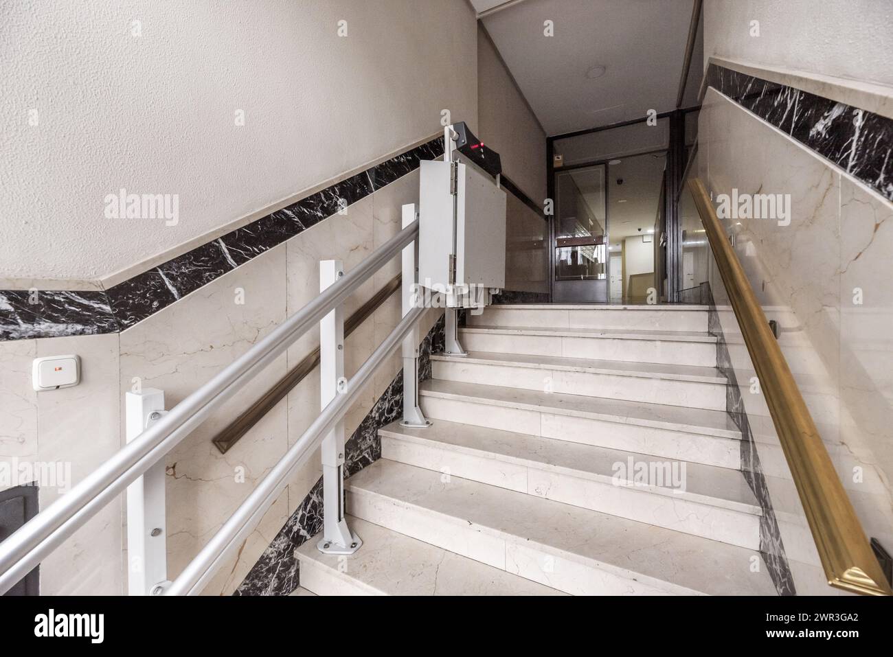 Access portal to a residential apartment building with marble-clad ...