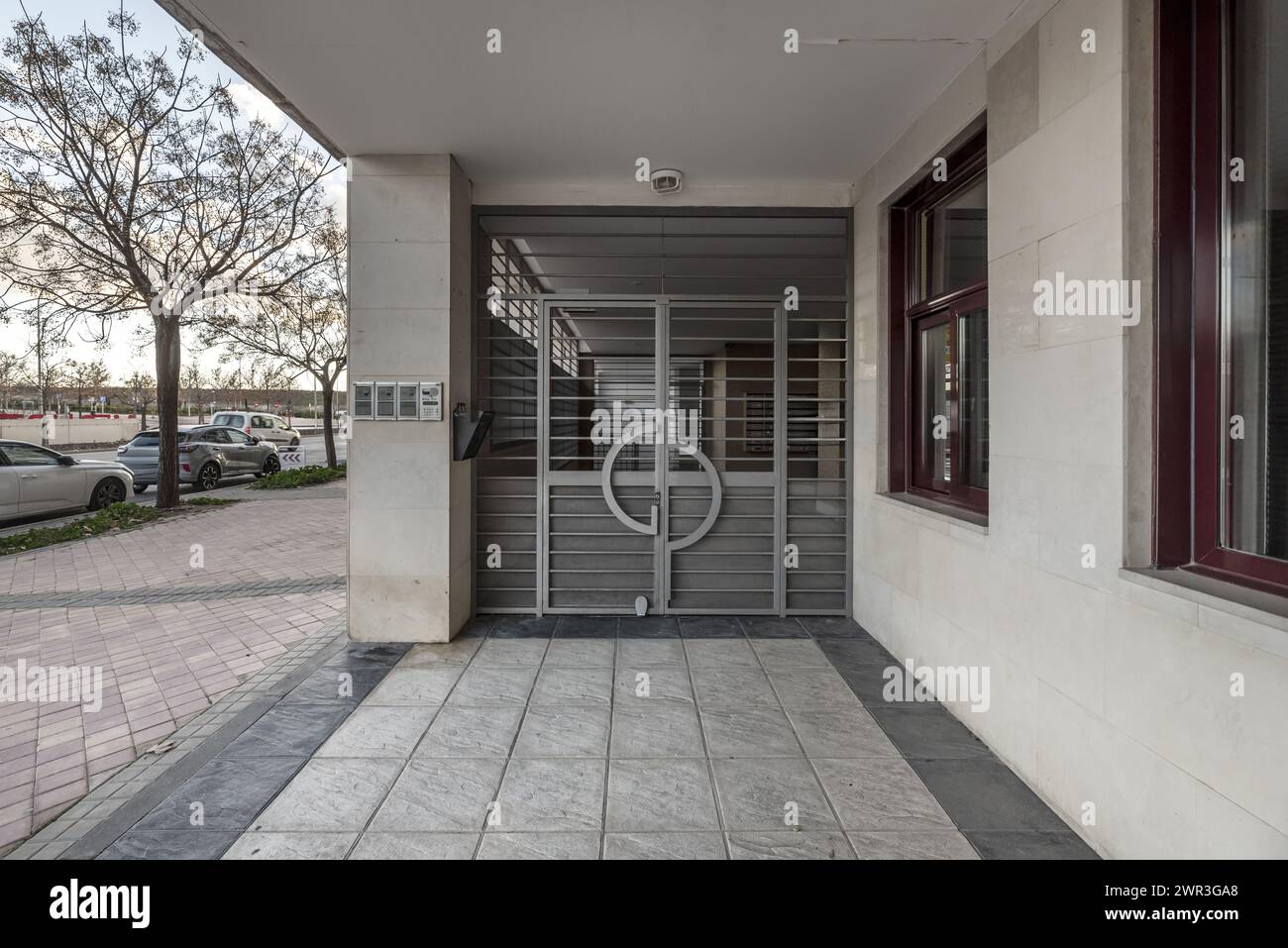 Exterior access portal to a residential apartment building at street ...